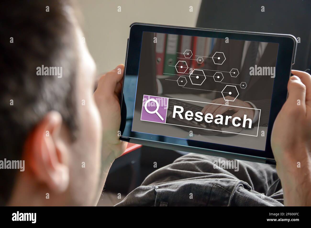 Research concept on a tablet Stock Photo - Alamy