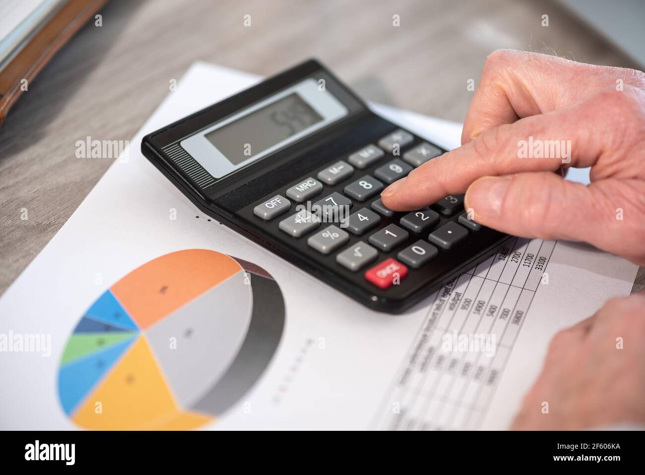 Data analysing hand calculator hi-res stock photography and images - Alamy