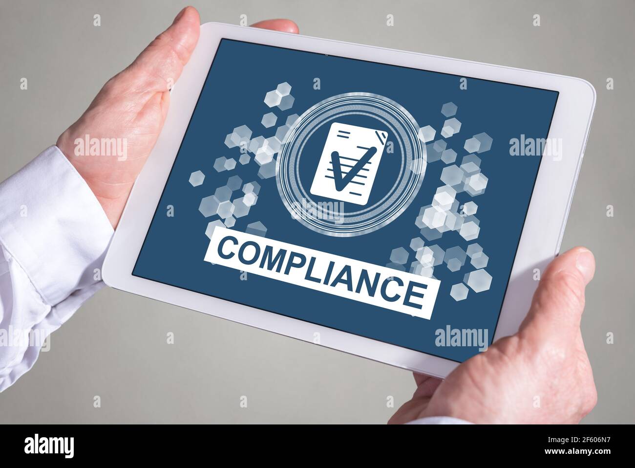 Tablet screen displaying a compliance concept Stock Photo - Alamy