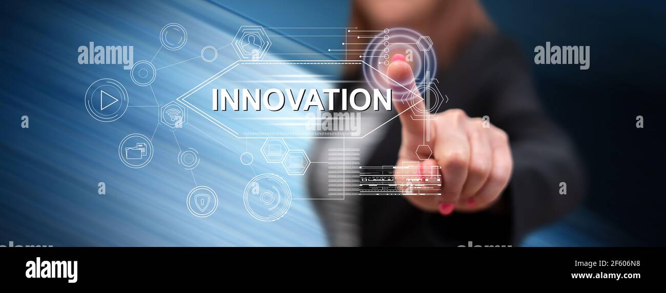 Woman touching an innovation concept on a touch screen with her finger ...