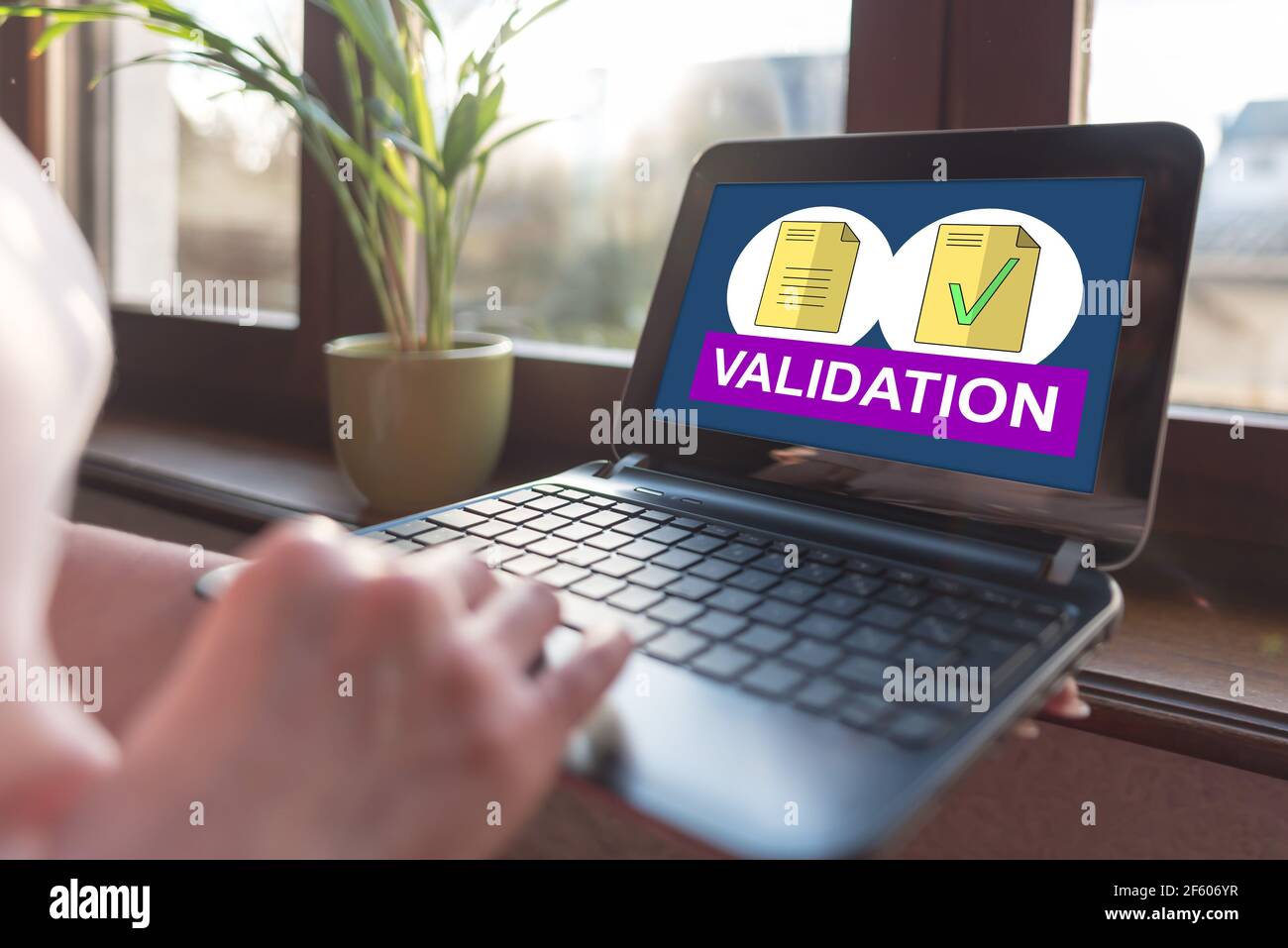 Laptop screen displaying a document validation concept Stock Photo - Alamy