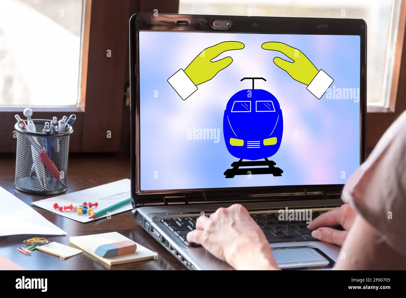 Laptop screen displaying a train insurance concept Stock Photo - Alamy