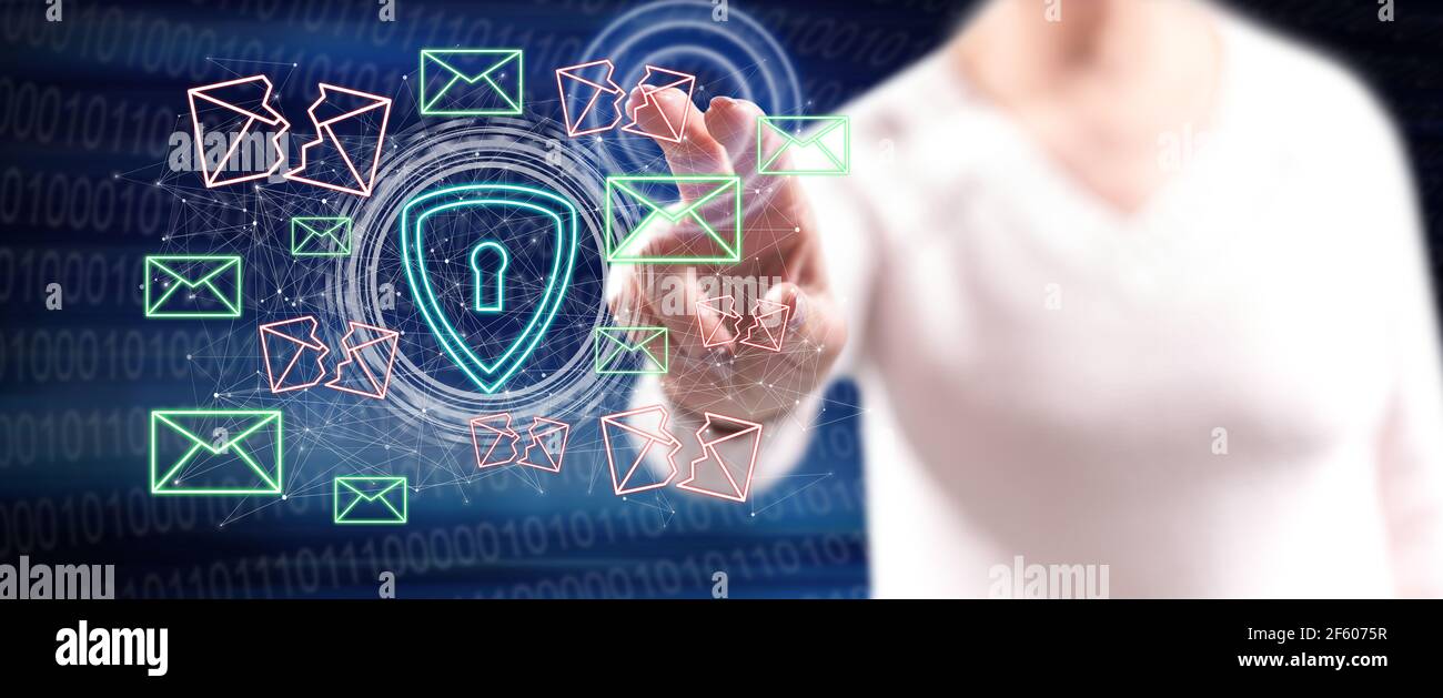 Woman touching an email protection concept on a touch screen with her ...