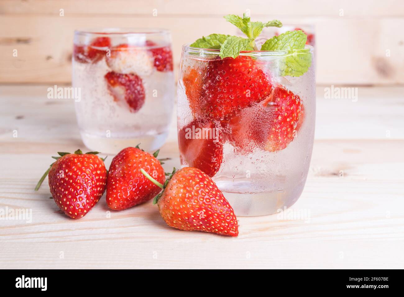 fresh fruit Strawberry with ice in glass Stock Photo - Alamy