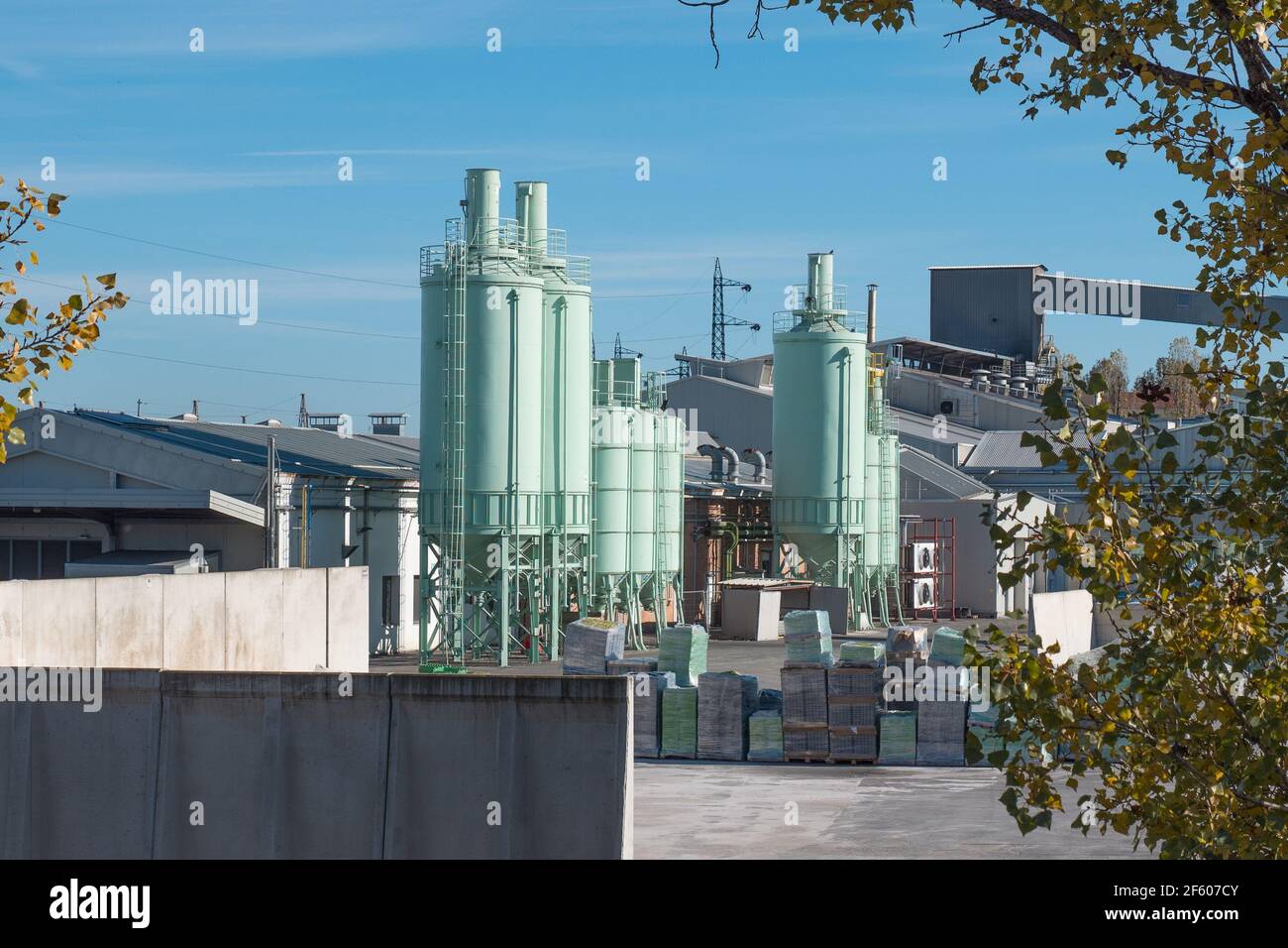 Outdoor Space of a Glass Factory with Vertical Tanks and selected Glass ...