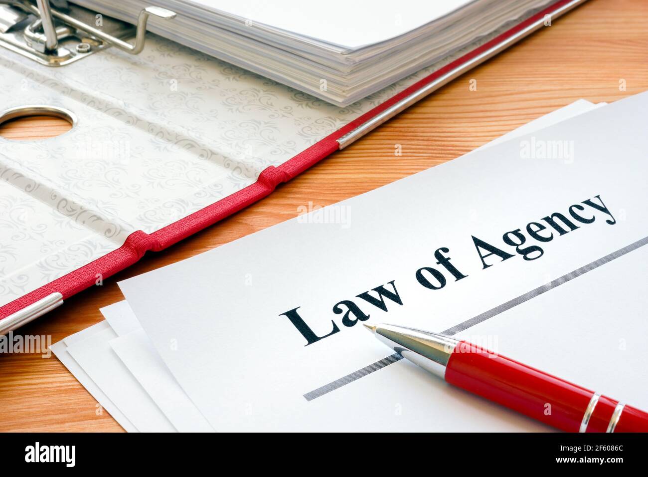 Law of agency papers near folder with contract Stock Photo - Alamy