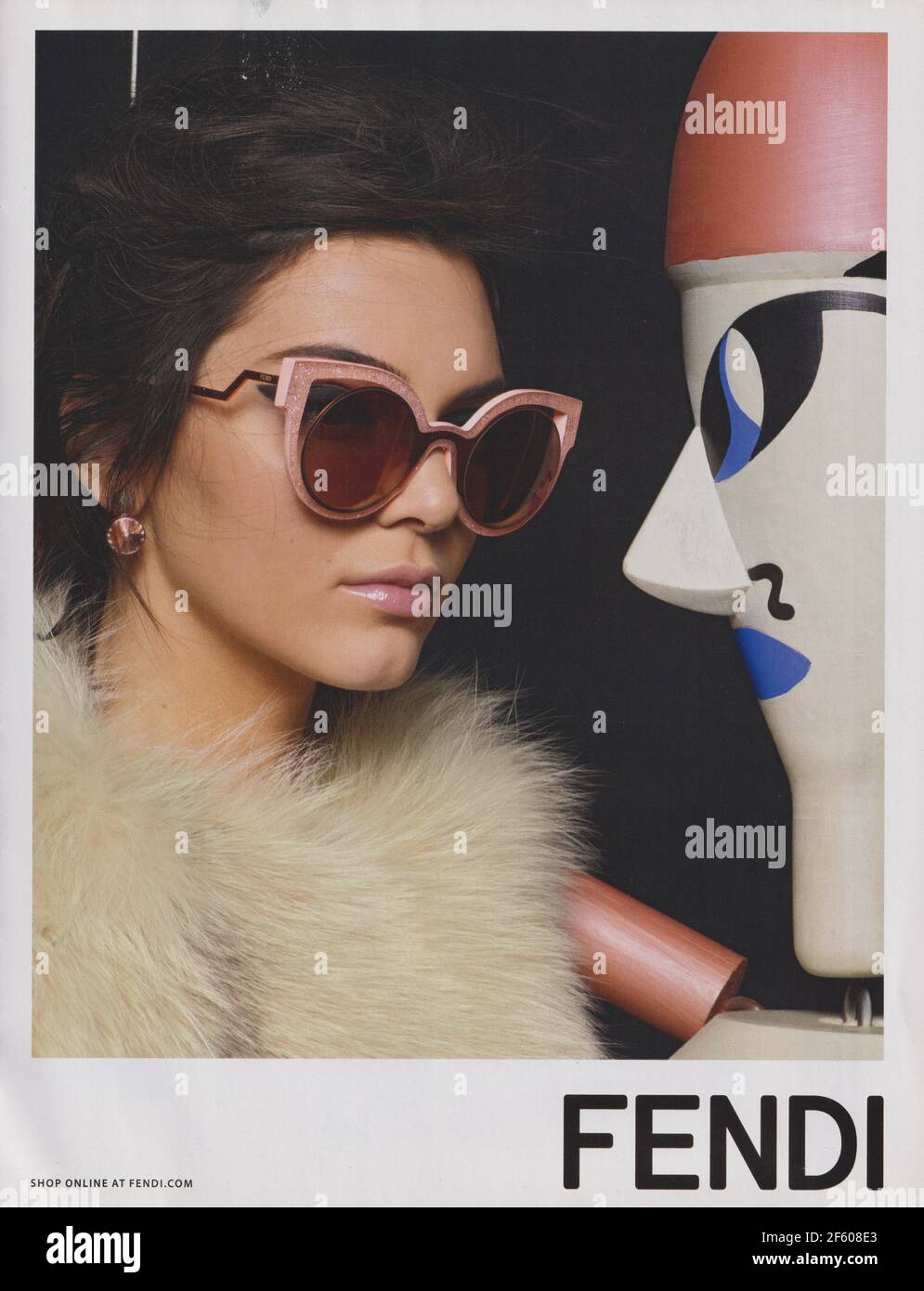 poster advertising FENDI fashion house with Kendall Jenner in paper ...