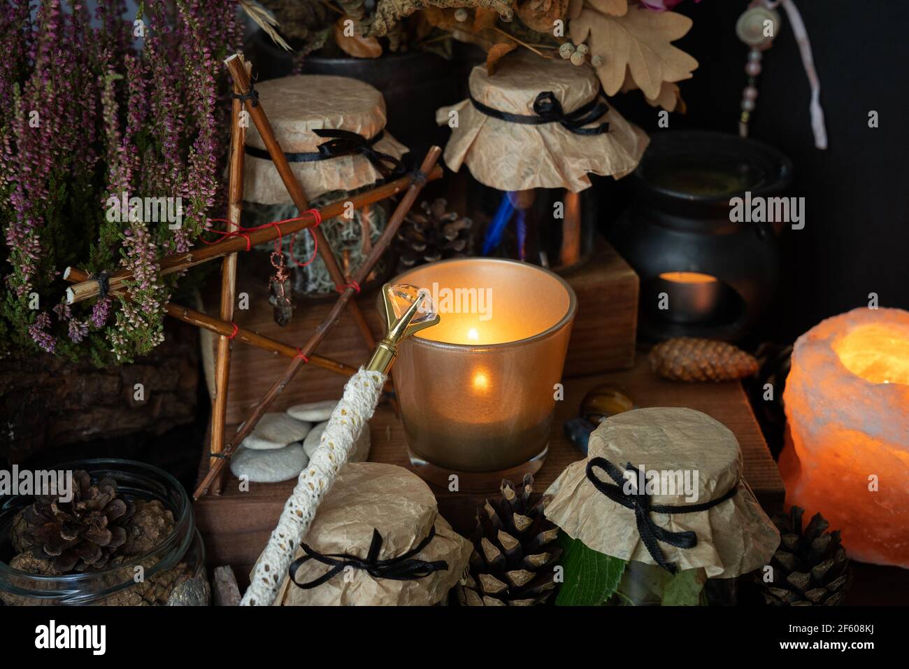 Magic wand with a crystal surrounded by pagan witchy objects Stock ...