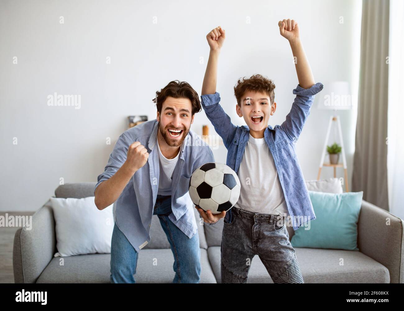 Dad and son at football match hi-res stock photography and images - Alamy