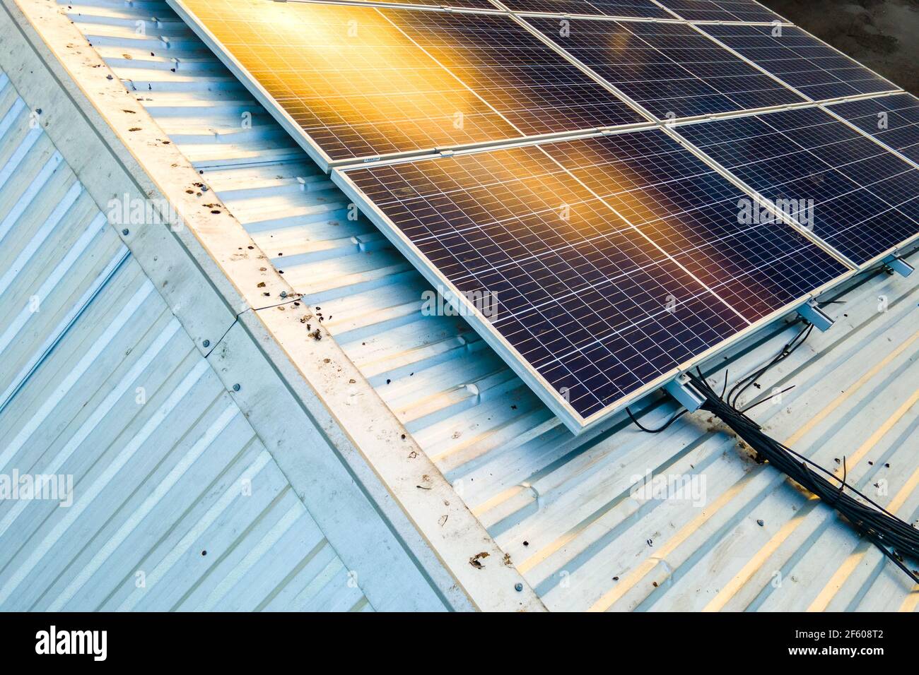 Aerial view of surface of blue photovoltaic solar panels mounted on ...