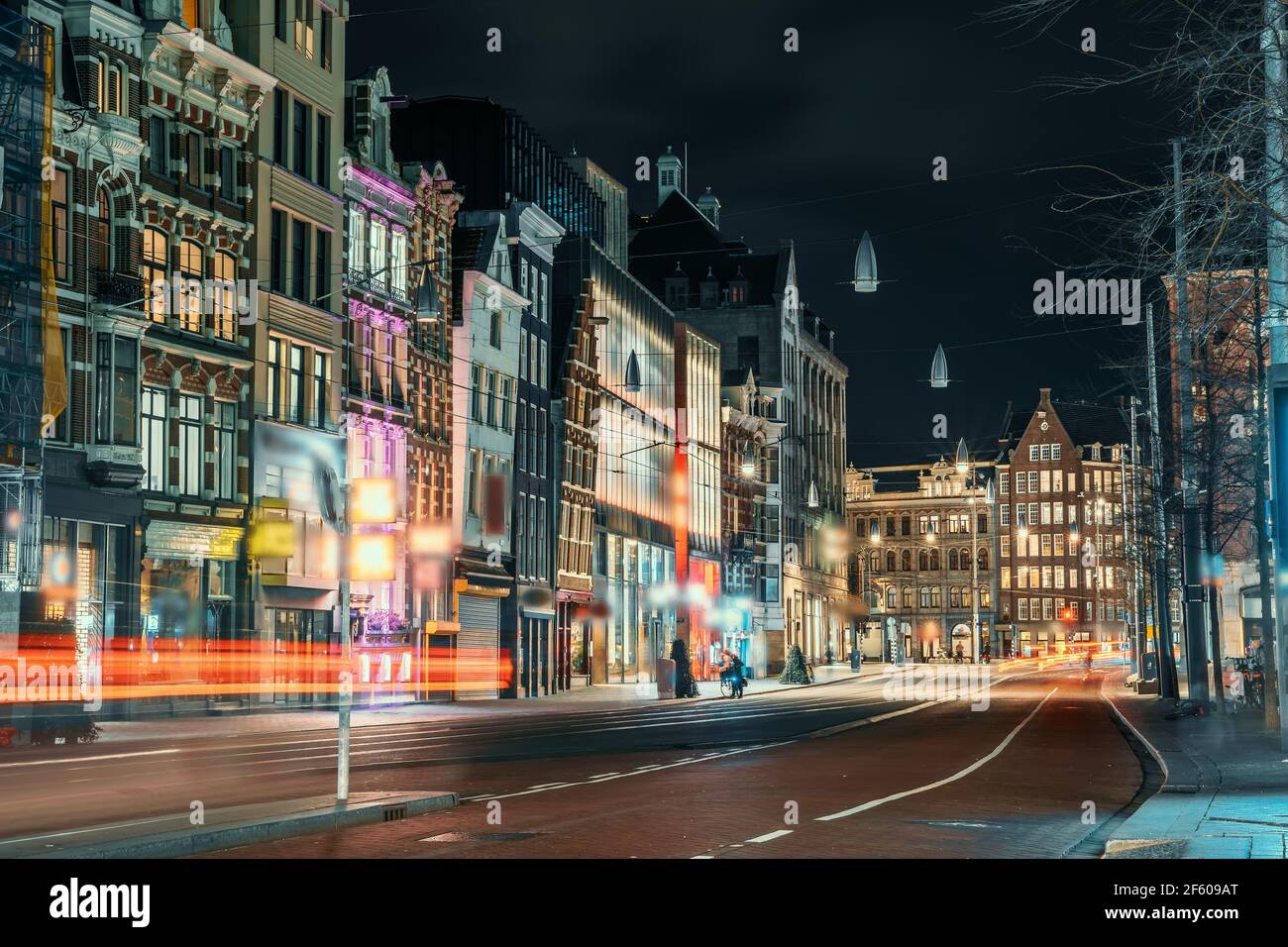 Night city view of Amsterdam city, street with illuminated buildings of ...