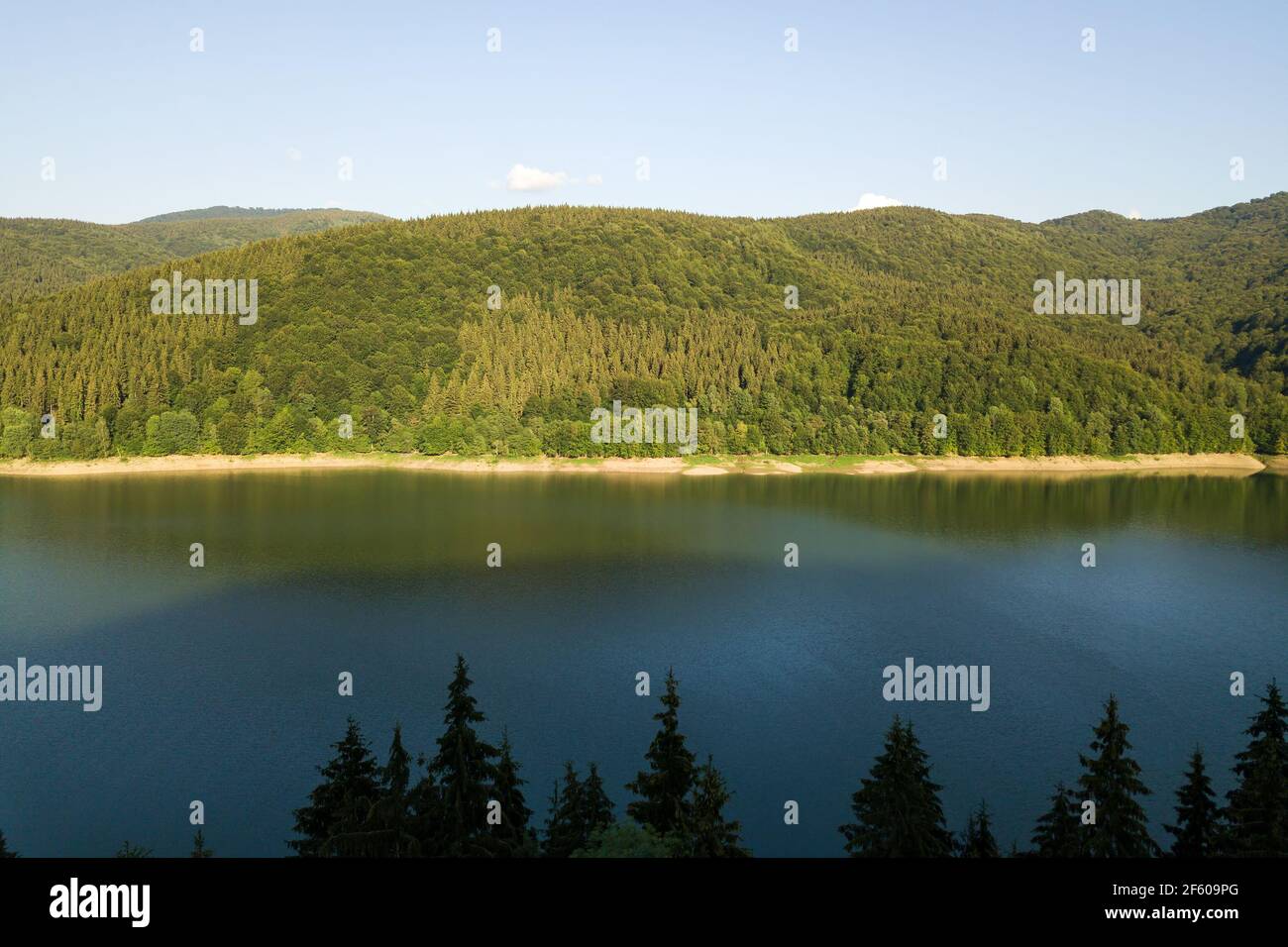 Aerial view of big lake with clear blue water between high mountain ...