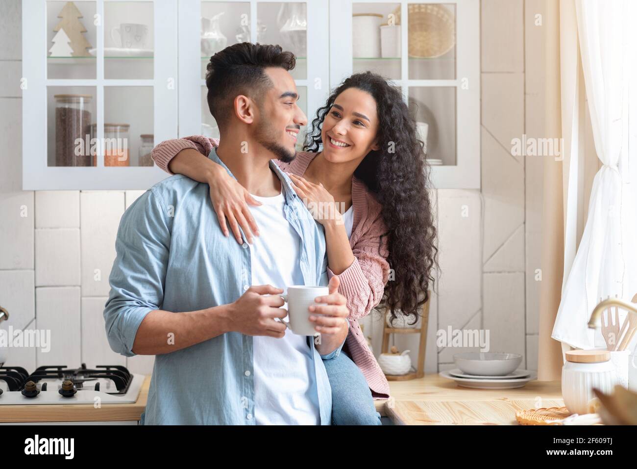 Beautiful couple hugging in kitchen hi-res stock photography and images ...