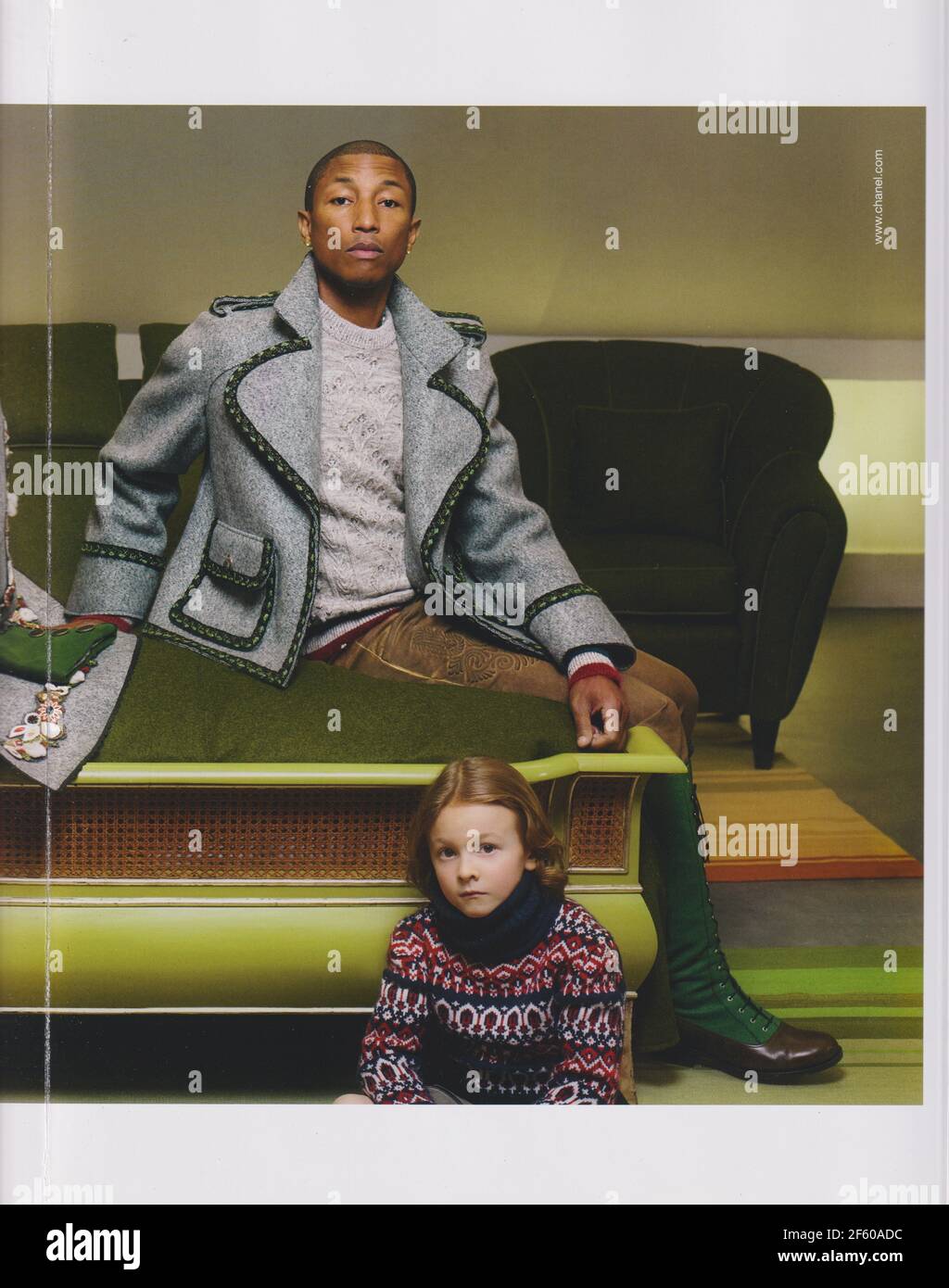 poster advertising CHANEL fashion house with Pharrell Williams in paper ...