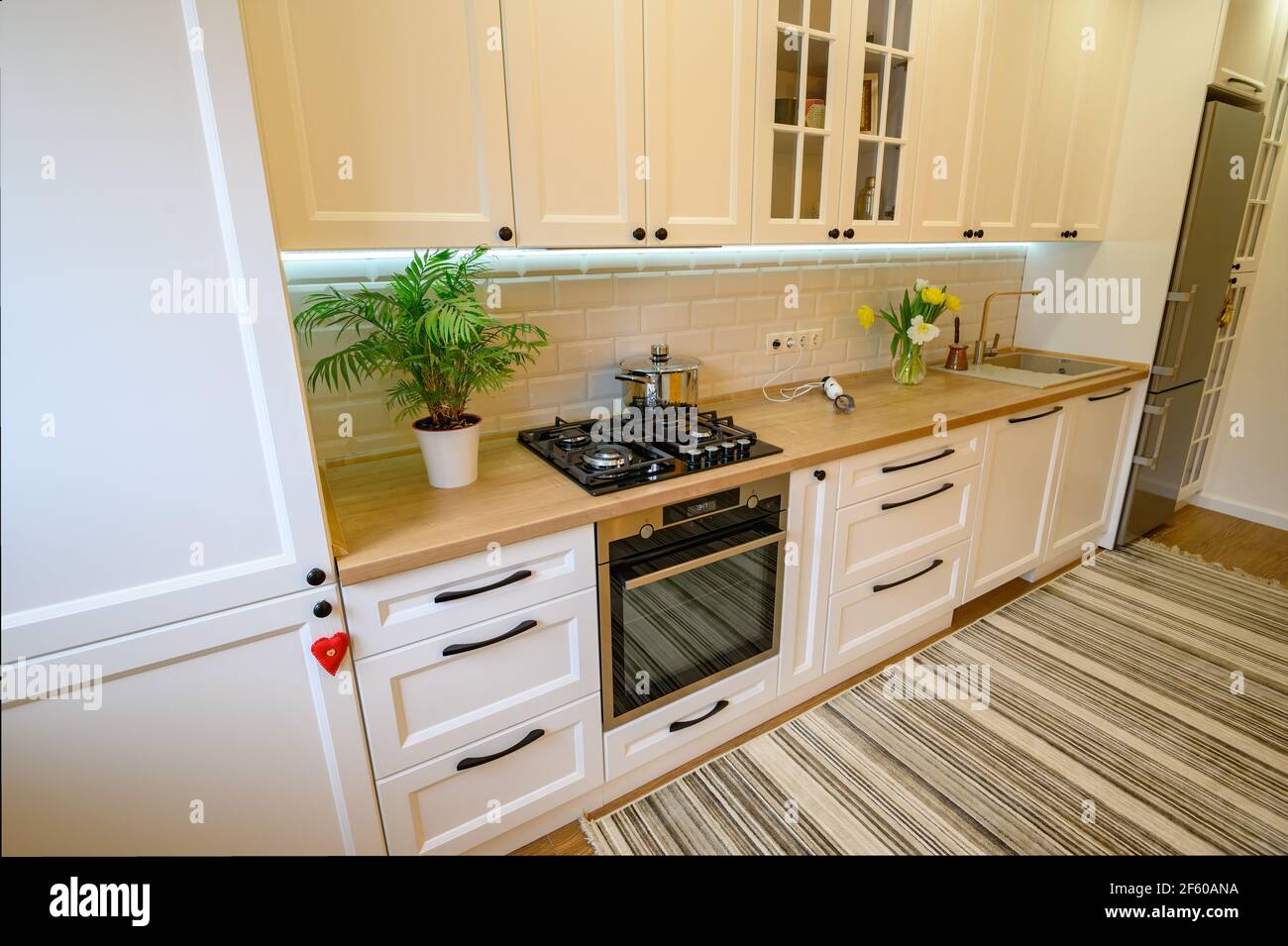 cozy modern well designed kitchen interior Stock Photo - Alamy