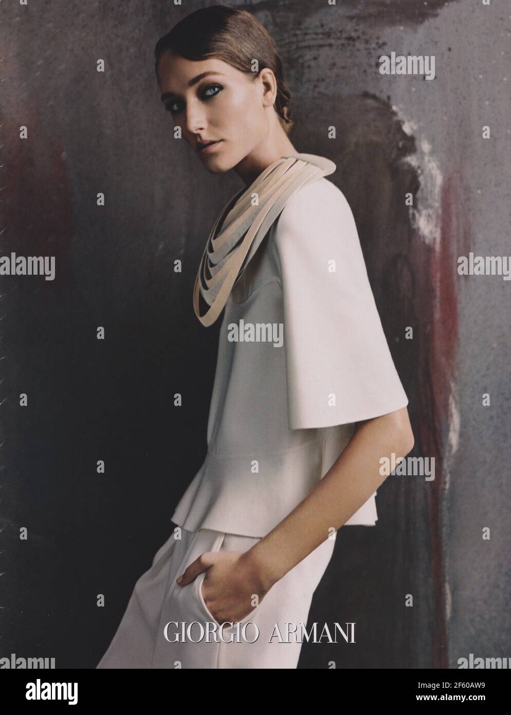 poster advertising Giorgio Armani with Josephine Le Tutour in paper ...