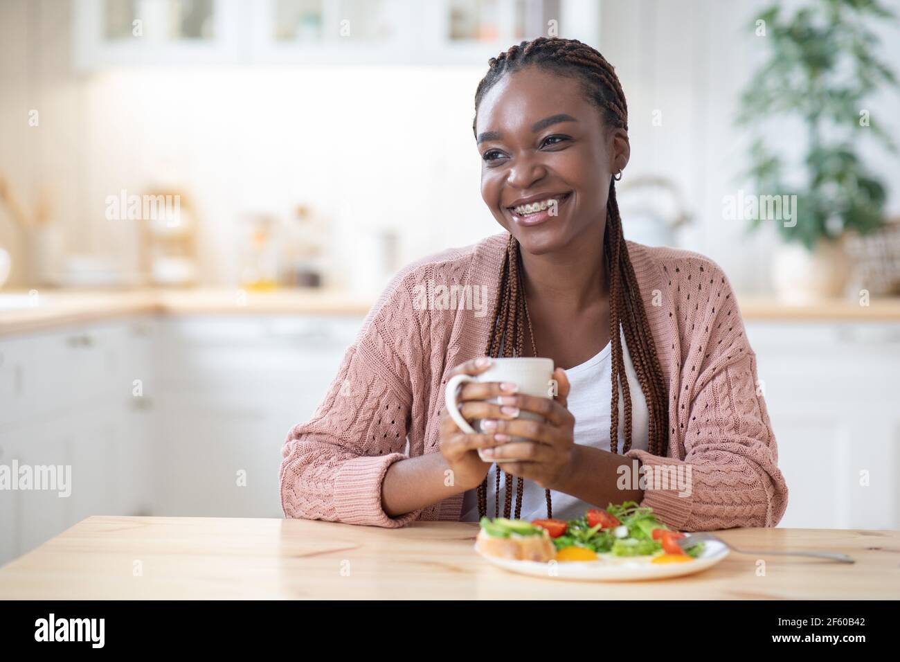 Start Of The Day. Happy Black Woman Eating Breakfast And Drinking ...