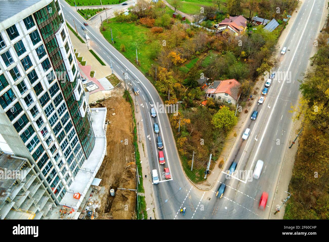 High rise apartment buildings and streets with traffic in city ...