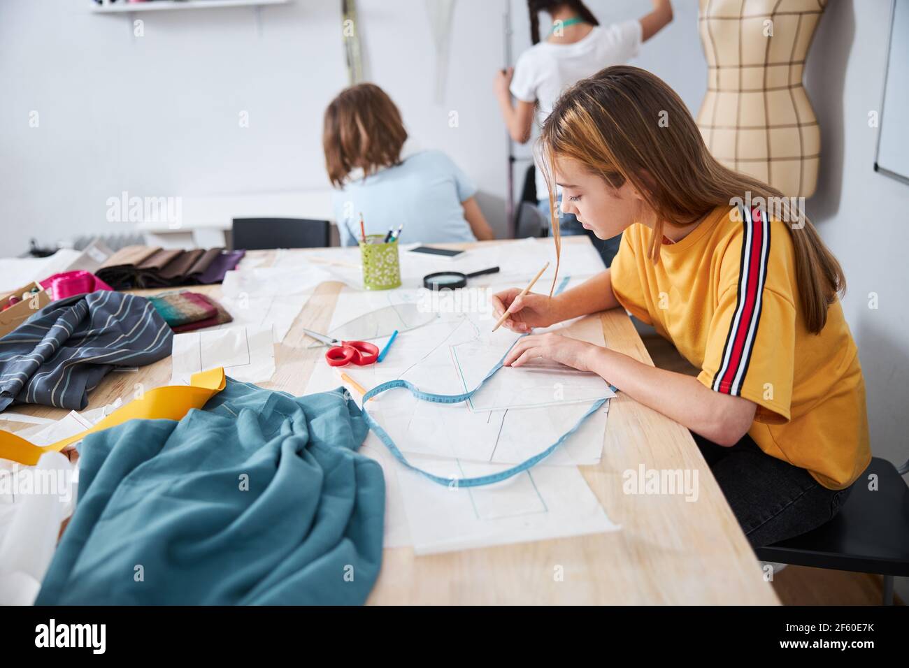 Clothes designer drawing patterns hi-res stock photography and images ...