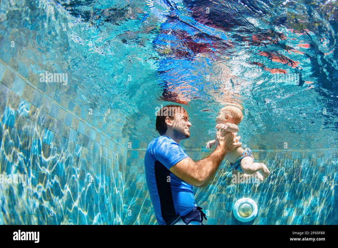Father son swimming underwater in hi-res stock photography and images ...