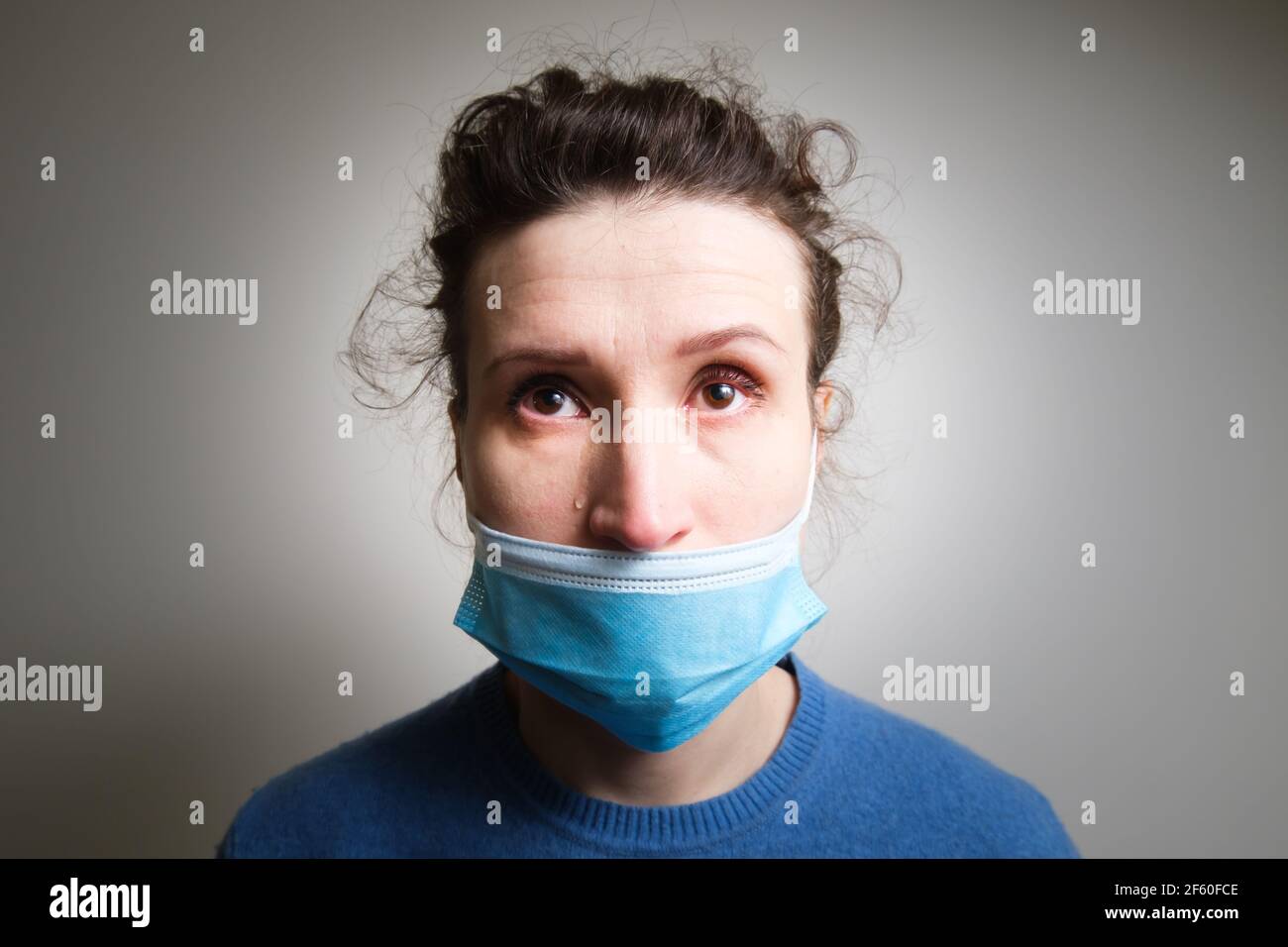 Masked girl crying Stock Photo - Alamy
