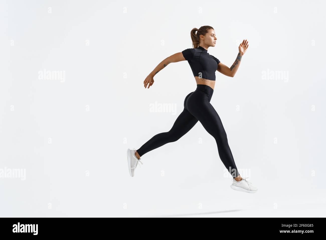Woman runner in silhouette on white background. Dynamic movement. Side ...
