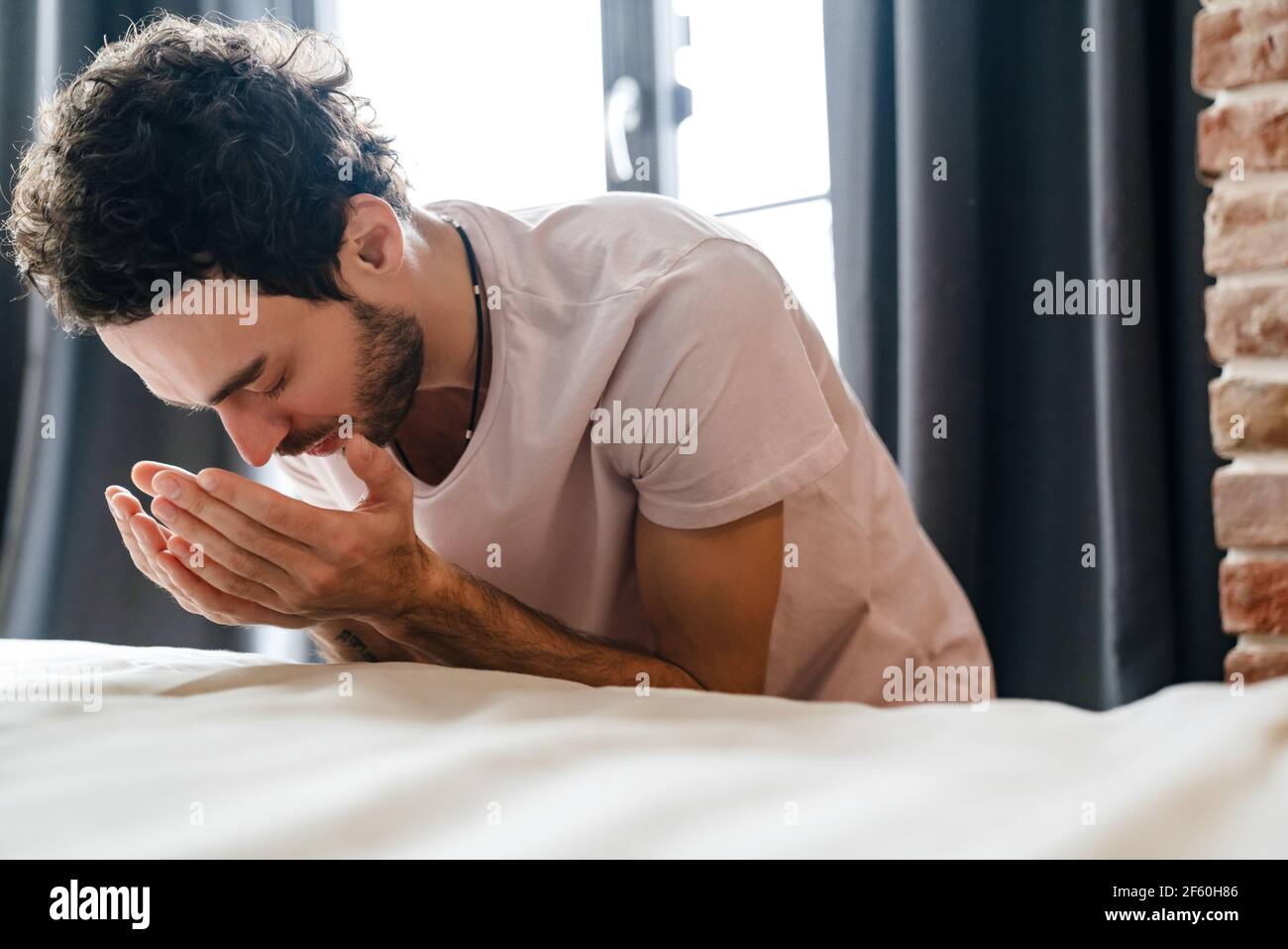 Praying with both hands together hi-res stock photography and images ...