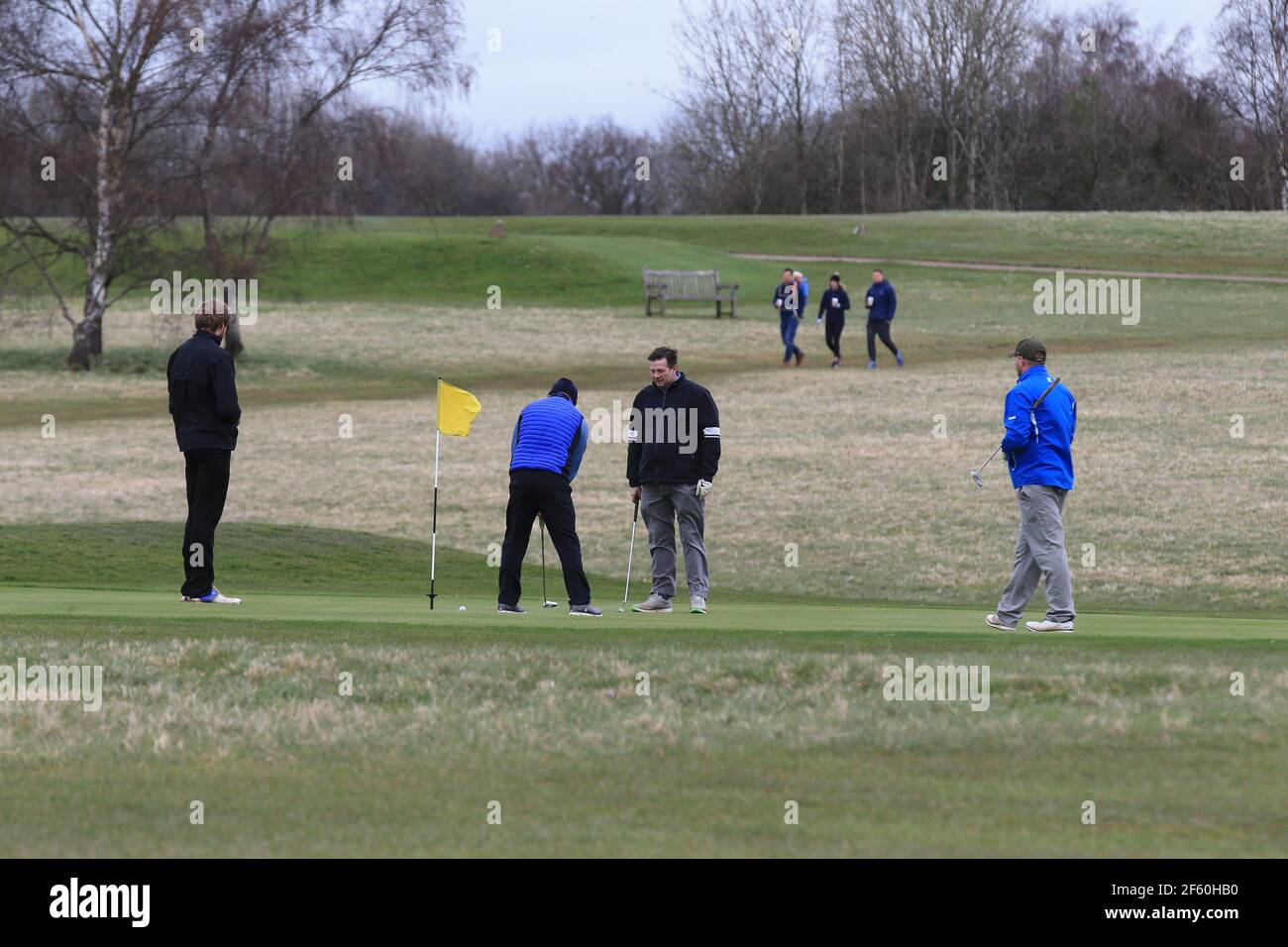 Golfers with caddies hi-res stock photography and images - Alamy