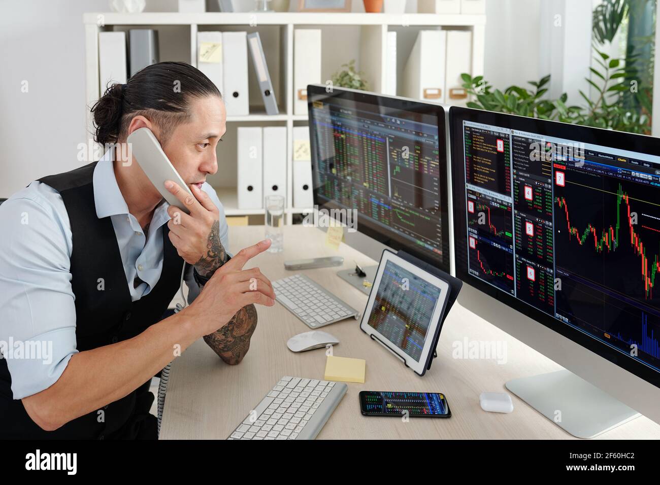 Professional trader checking stock market data on screens on computer ...