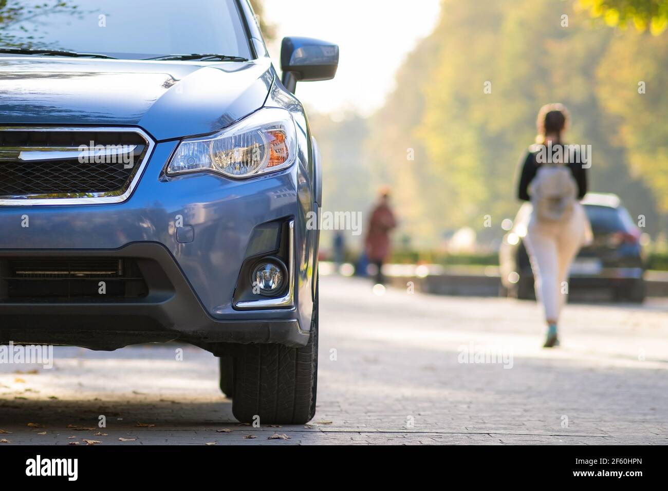 New clean car parked on a city street side Stock Photo - Alamy