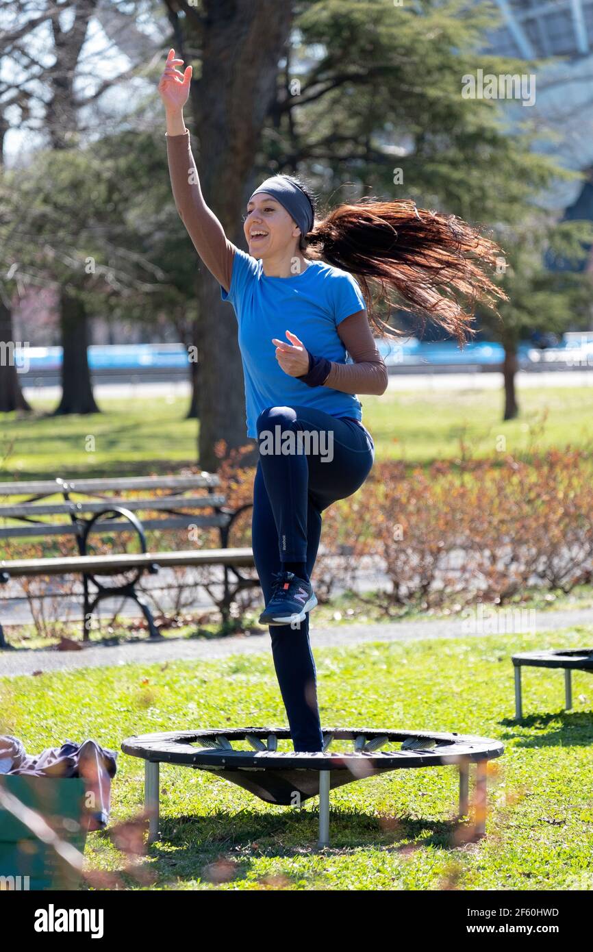 An attractive fit woman at an urban rebounding class in Queens, New ...