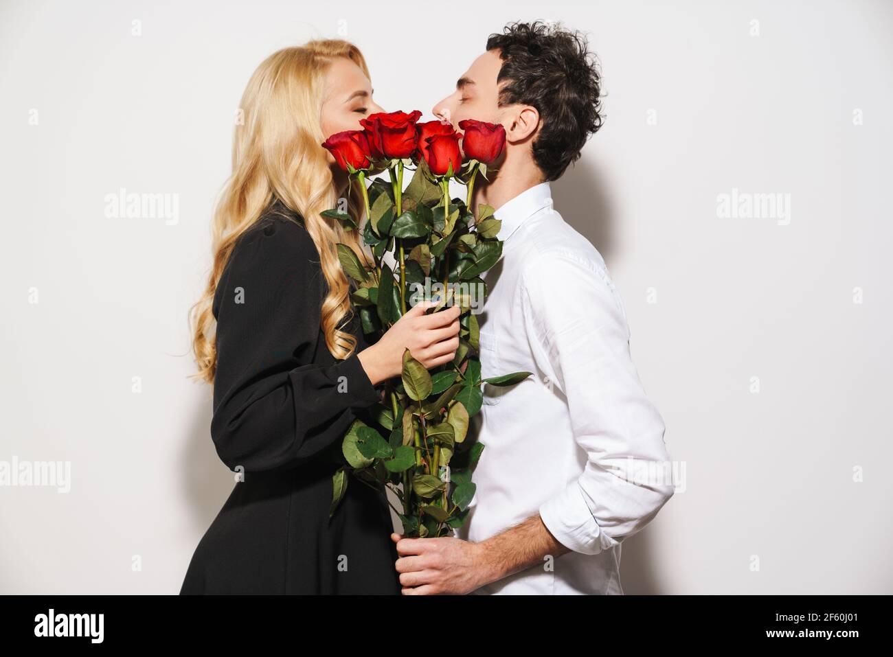 Lovely romantic young happy couple celebrating an event together, woman ...