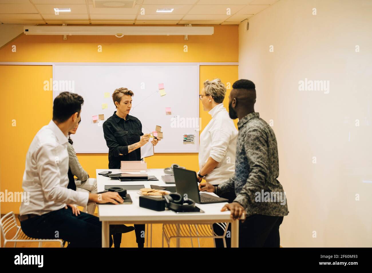 Business people discussing at conference table in board room Stock ...