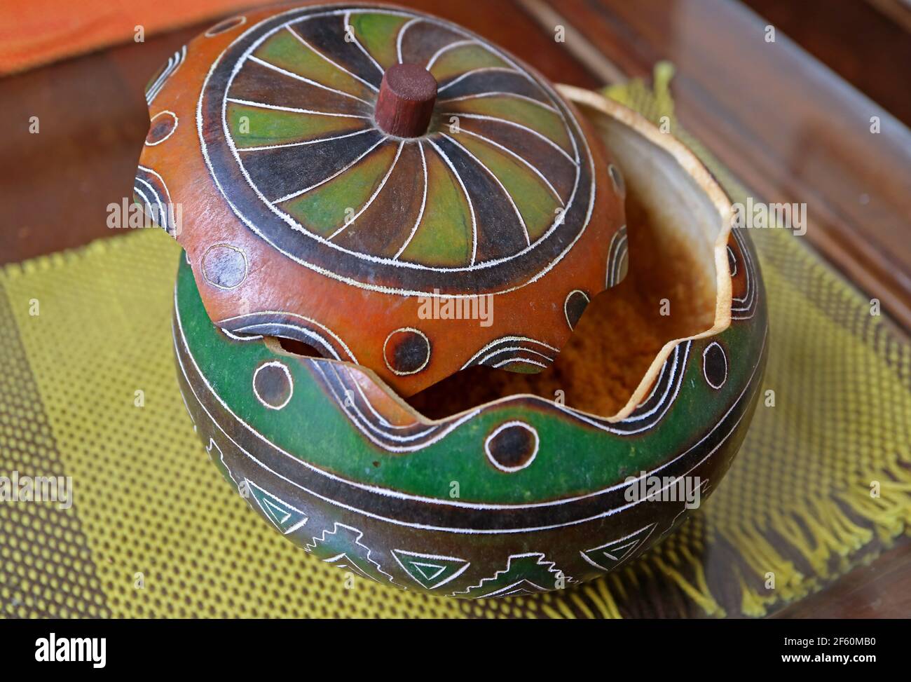 Closeup of a Peruvian traditional wooden craft sugar pot with brown ...