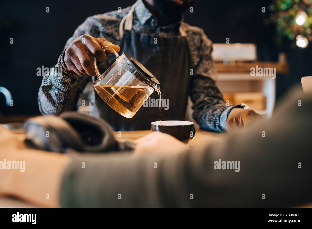 Tea pouring into cup hi-res stock photography and images - Alamy
