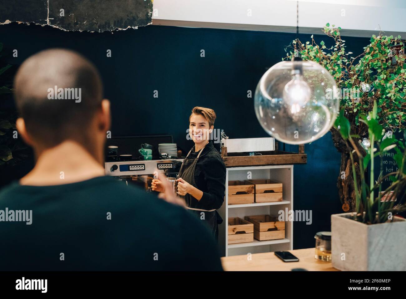 Cafe owner talking to customer hi-res stock photography and images - Alamy