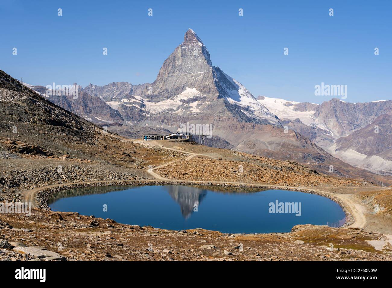 Reflection of the famous Matterhorn peak in a pond in the Gornergrat ...