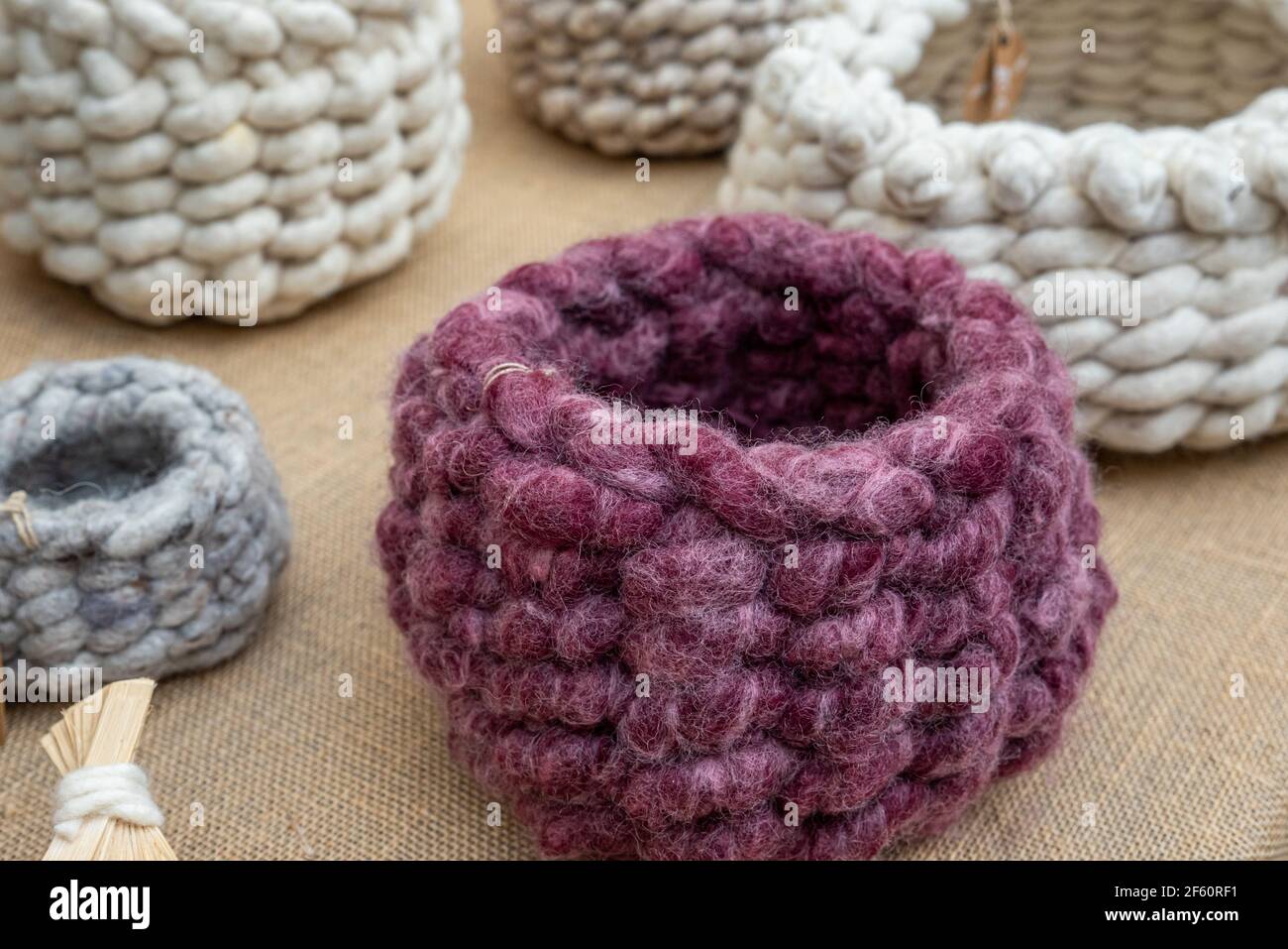 Handmade crocheted sheep wool baskets Stock Photo - Alamy