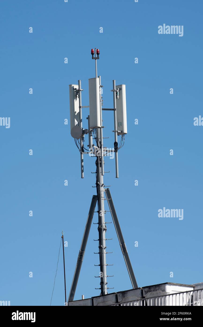 Cellular transmitters on top of building with a blue sky morning Stock ...