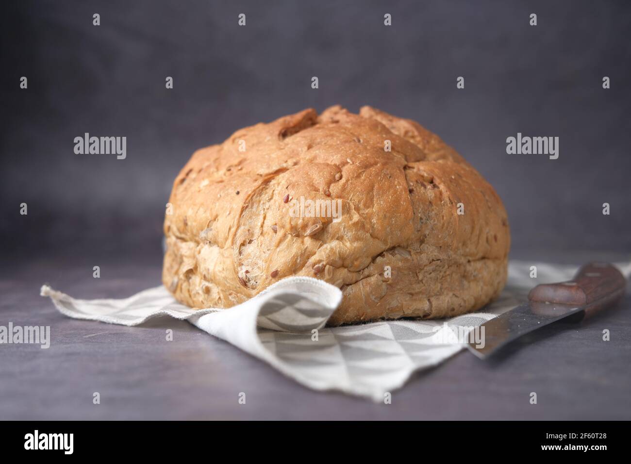close up of round shape baked brown bread on table Stock Photo - Alamy