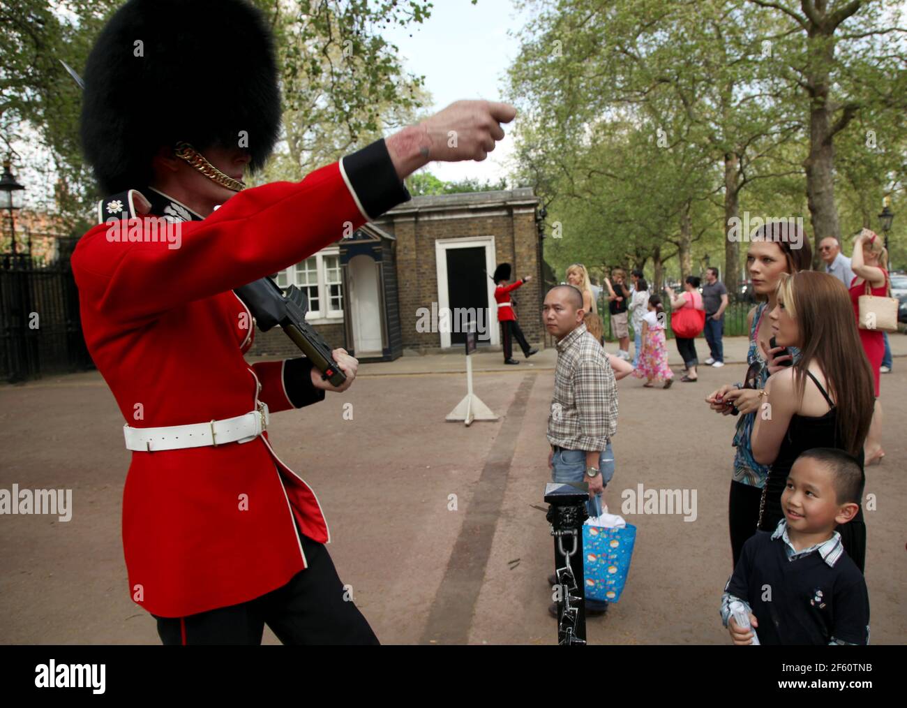 21 April 2011. London, England. Tourists watch a Royal Foot Guard, a ...