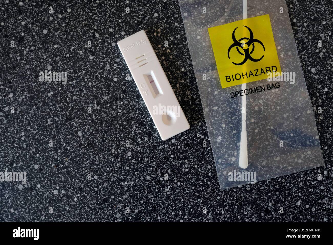 Coronavirus (COVID-19) rapid test with negative result next to a nasal ...