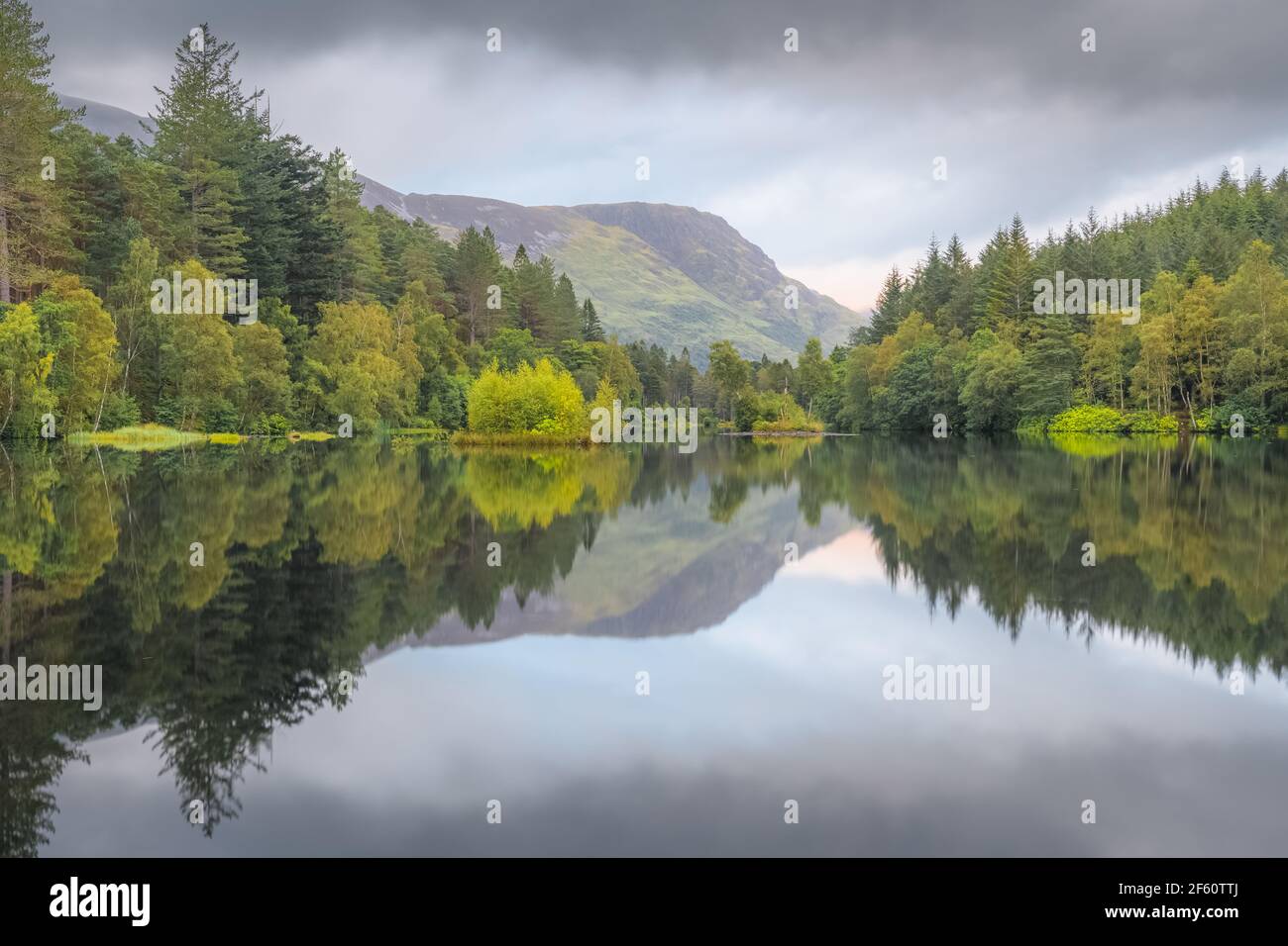 Calm, idyllic mountain landscape lake reflection on Glencoe Lochan on a ...