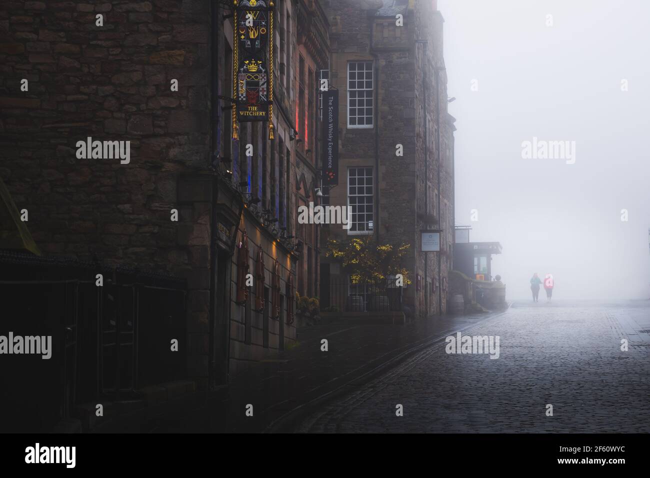 Edinburgh, Scotland - June 16 2020: Two silhouettes emerge in moody ...