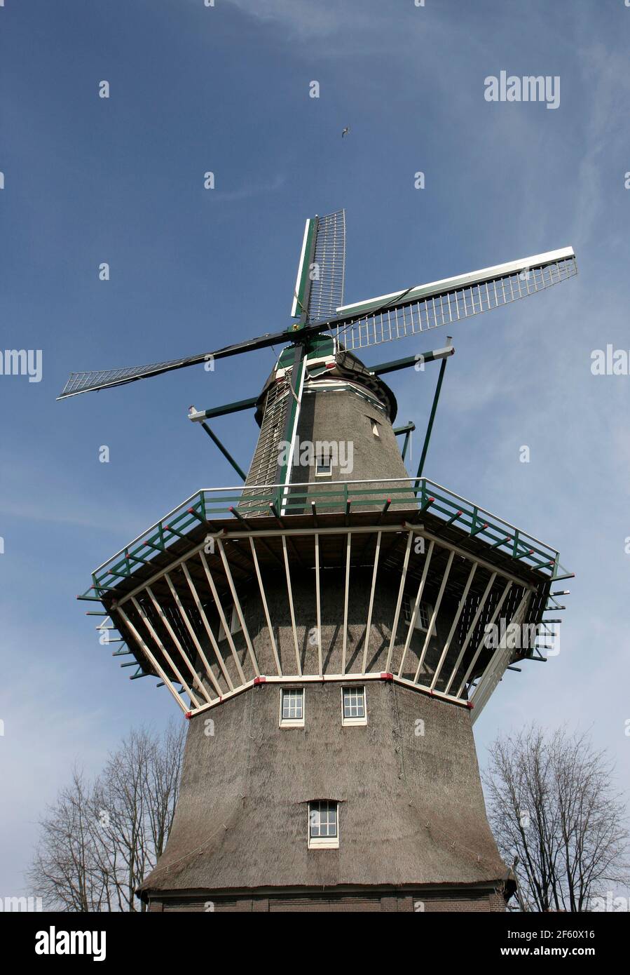 Traditional Wooden Dutch Windmill with Blue Sky Background in Amsterdam ...