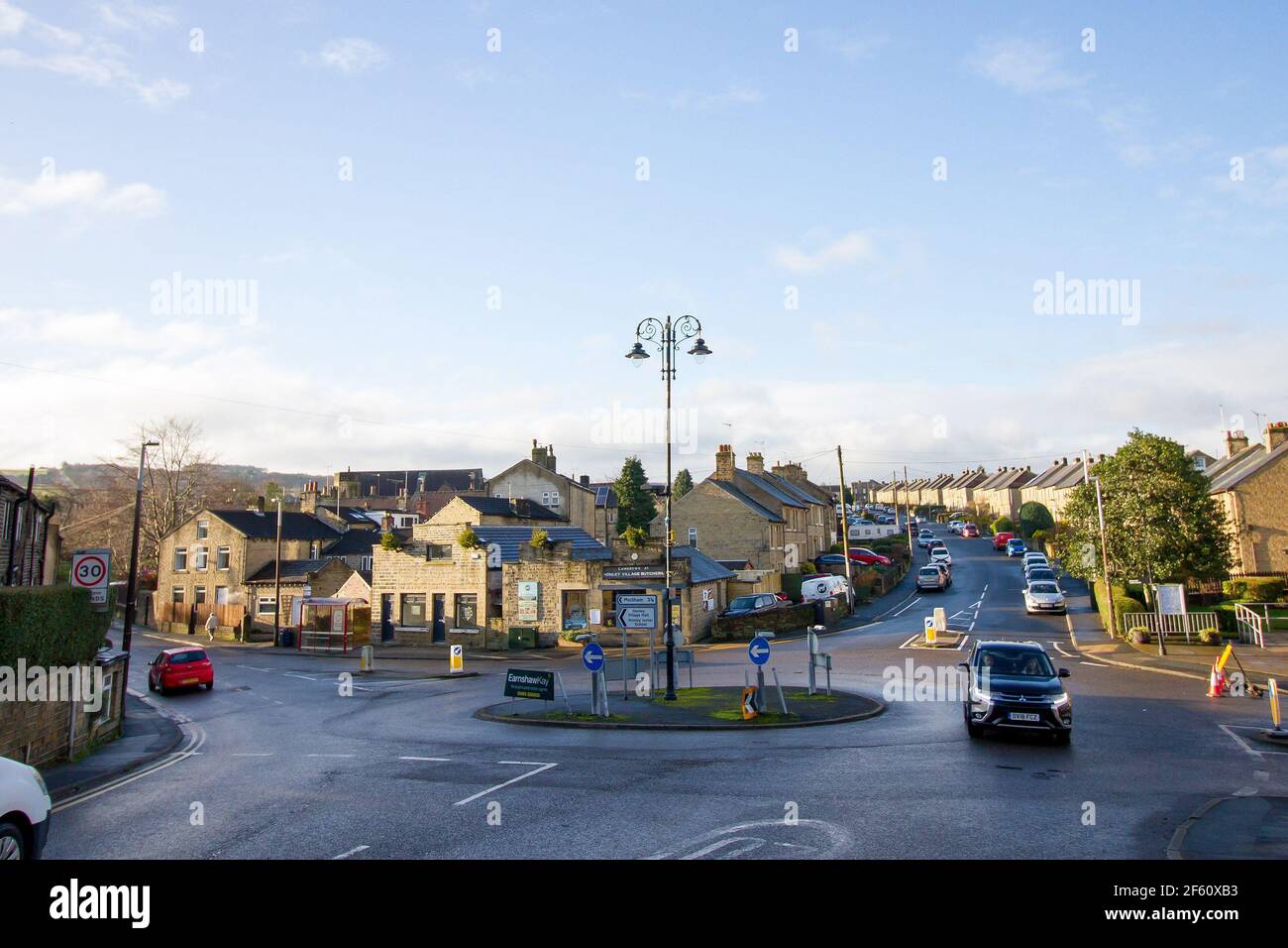 Honley Village Roundabout with traffic Stock Photo - Alamy