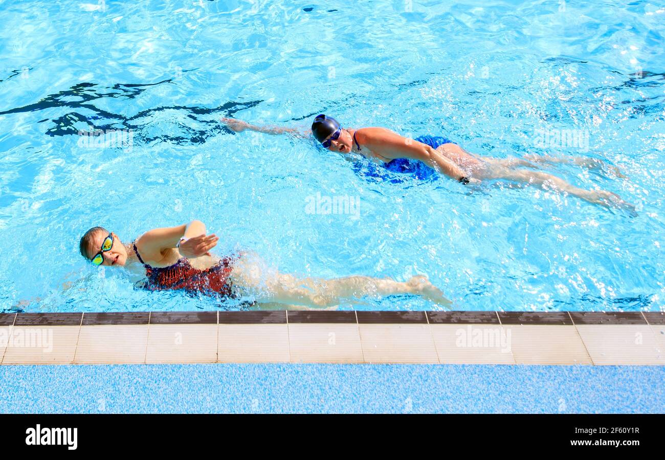 People swim in Hathersage outdoor swimming pool near Hope Valley ...