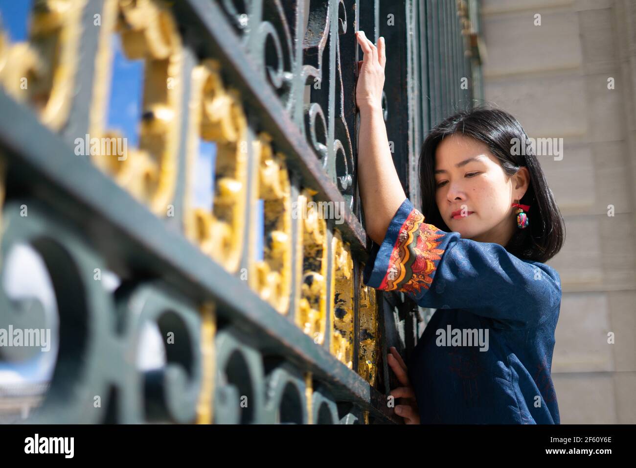 young asiatic woman model posing with traditional dress with an ...