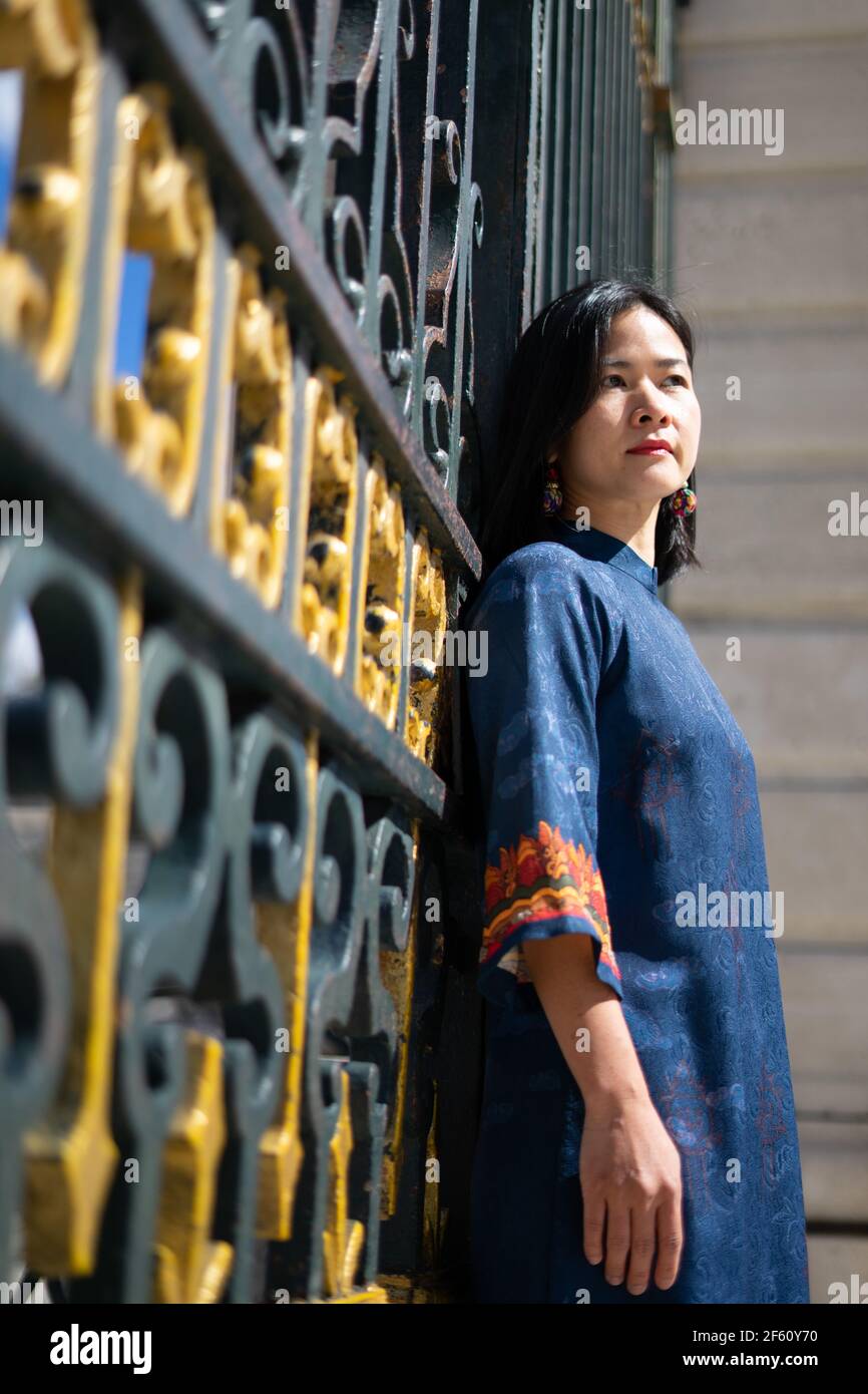 young asiatic woman model posing with traditional dress with an ...
