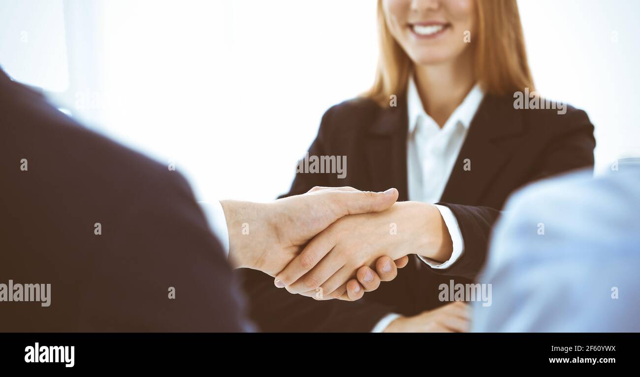 Business people or lawyers shaking hands finishing up a meeting, close ...